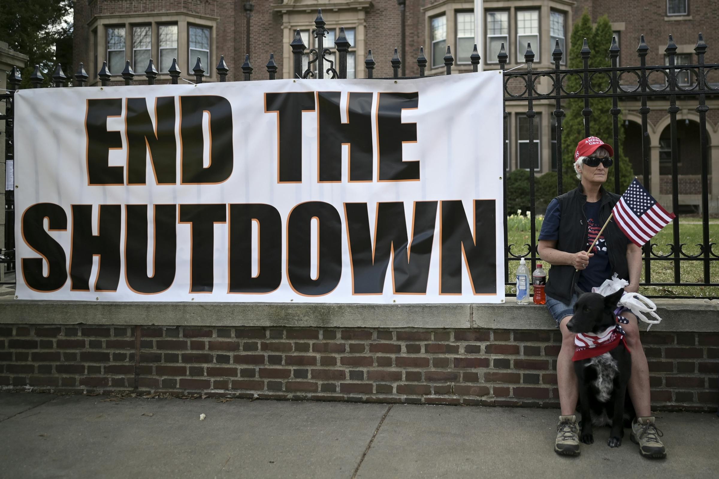 With honks, signs and flags, about 250 protest Walz's antivirus measures