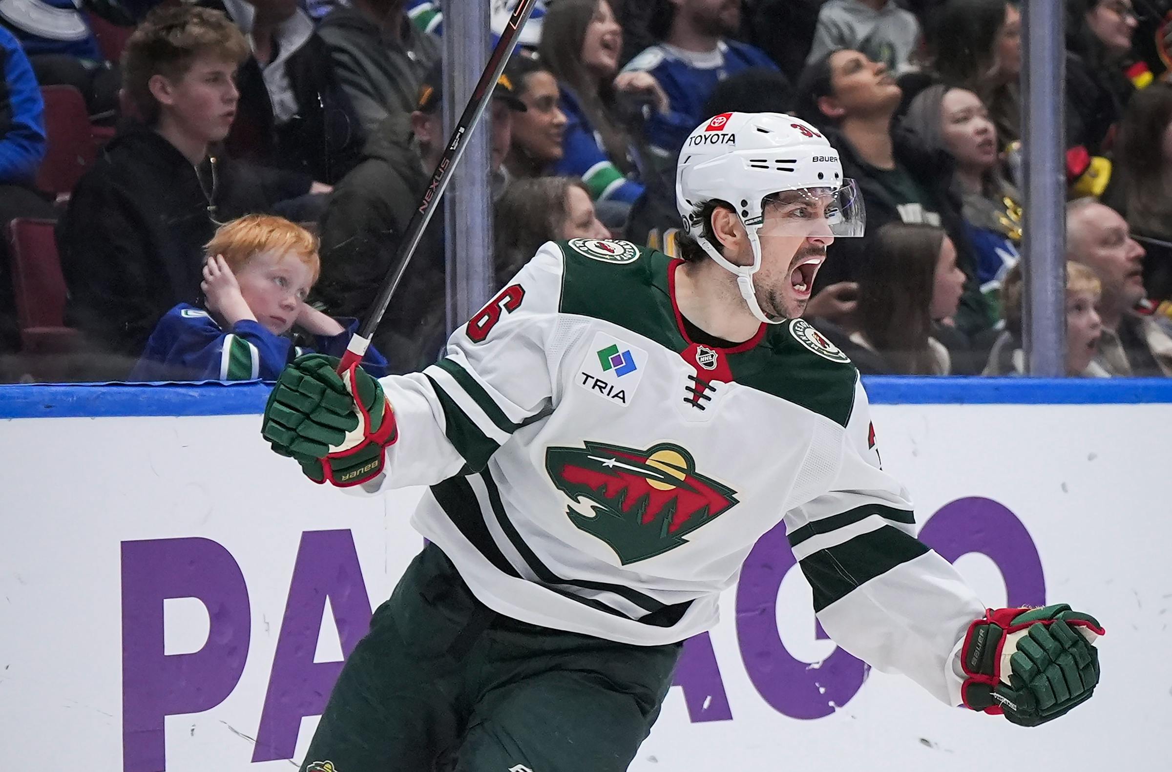 Minnesota Wild win in OT at Vancouver, build playoff hopes