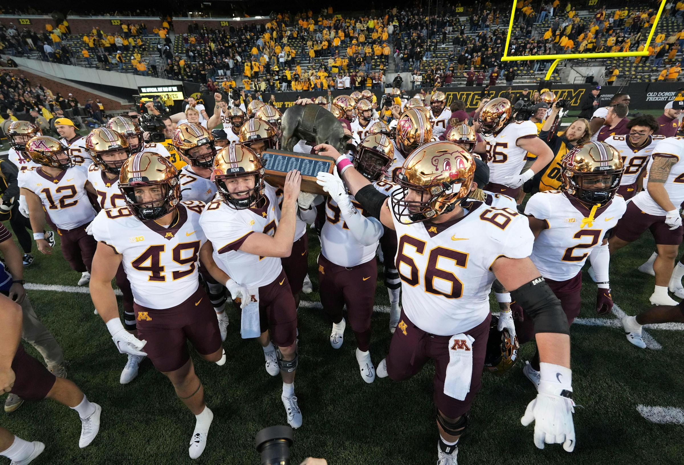Gophers football beats Iowa 12-10 in wild, controversial battle; first ...