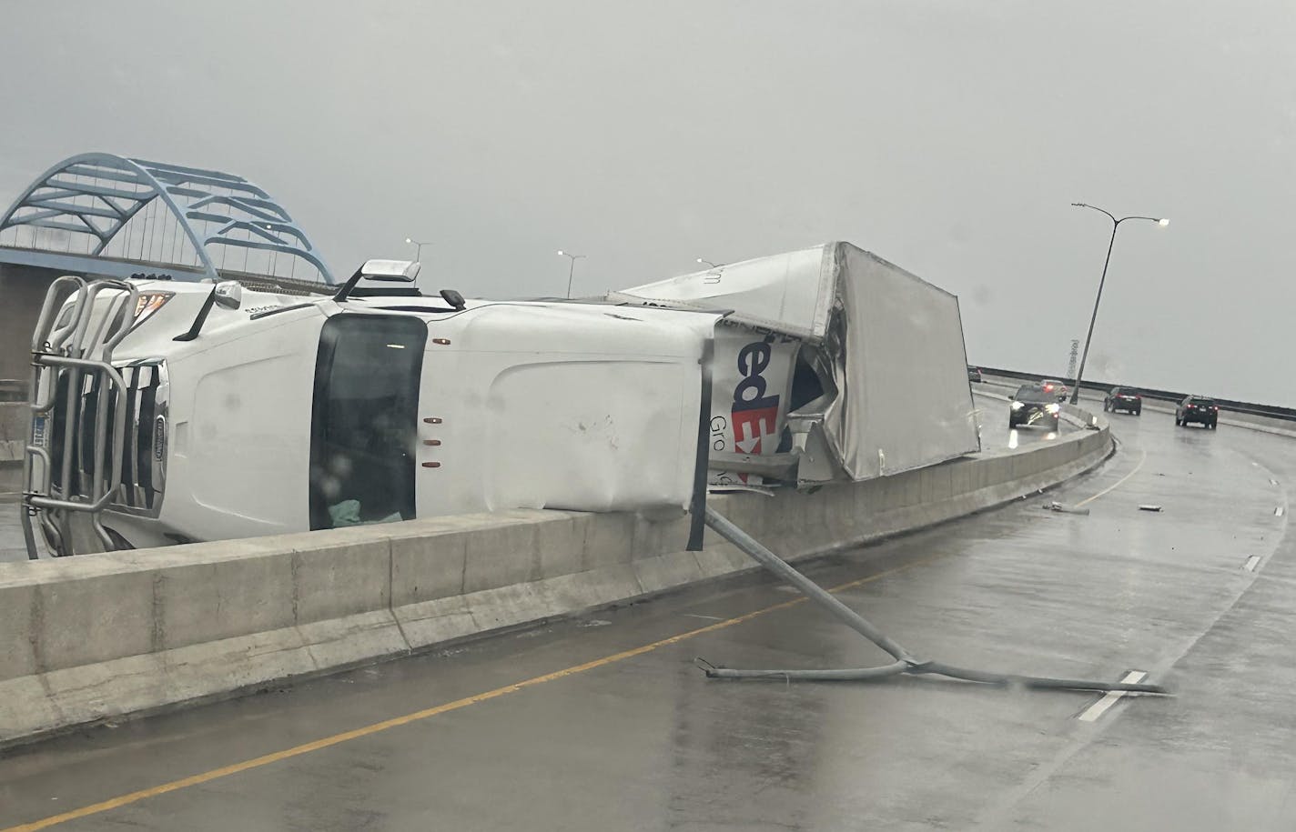 High winds flipped a FedEx truck traveling on Bong Bridge in Duluth