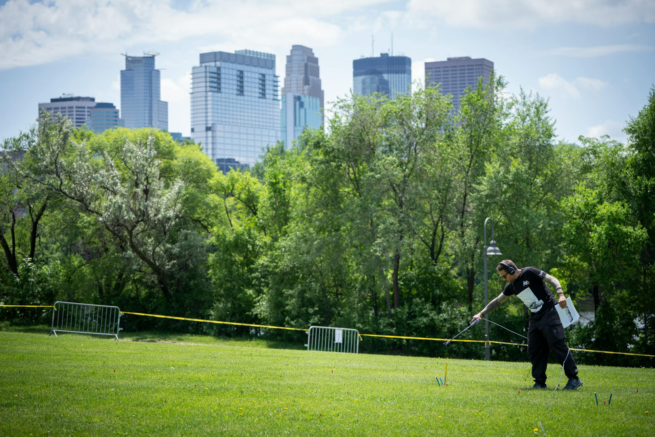 International artist Saype paints gigantic hands in Minneapolis' Boom ...