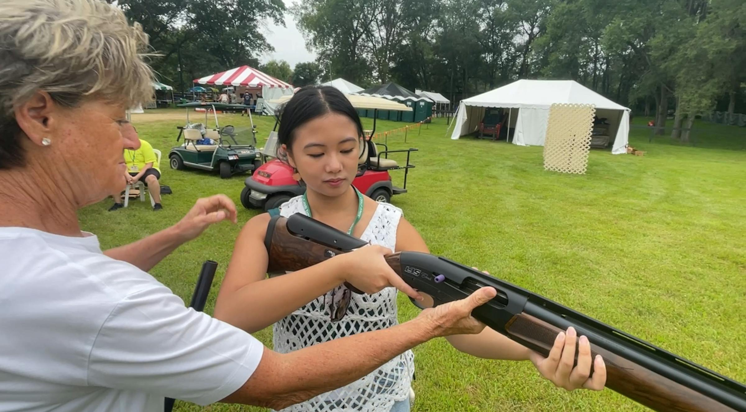 A first-timer tries duck calling, shooting at the Game Fair