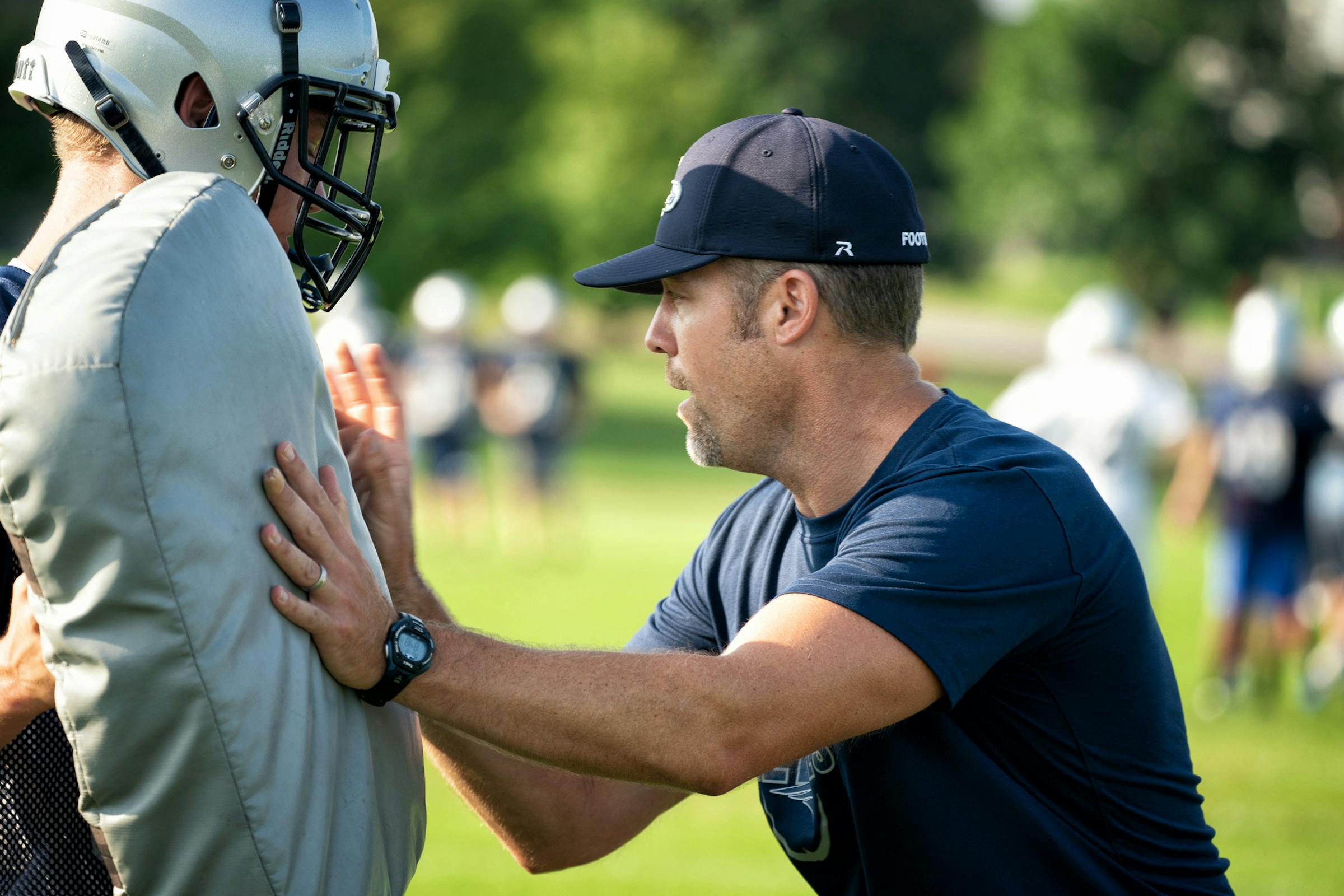 New Champlin Park football coach attracts a crowd