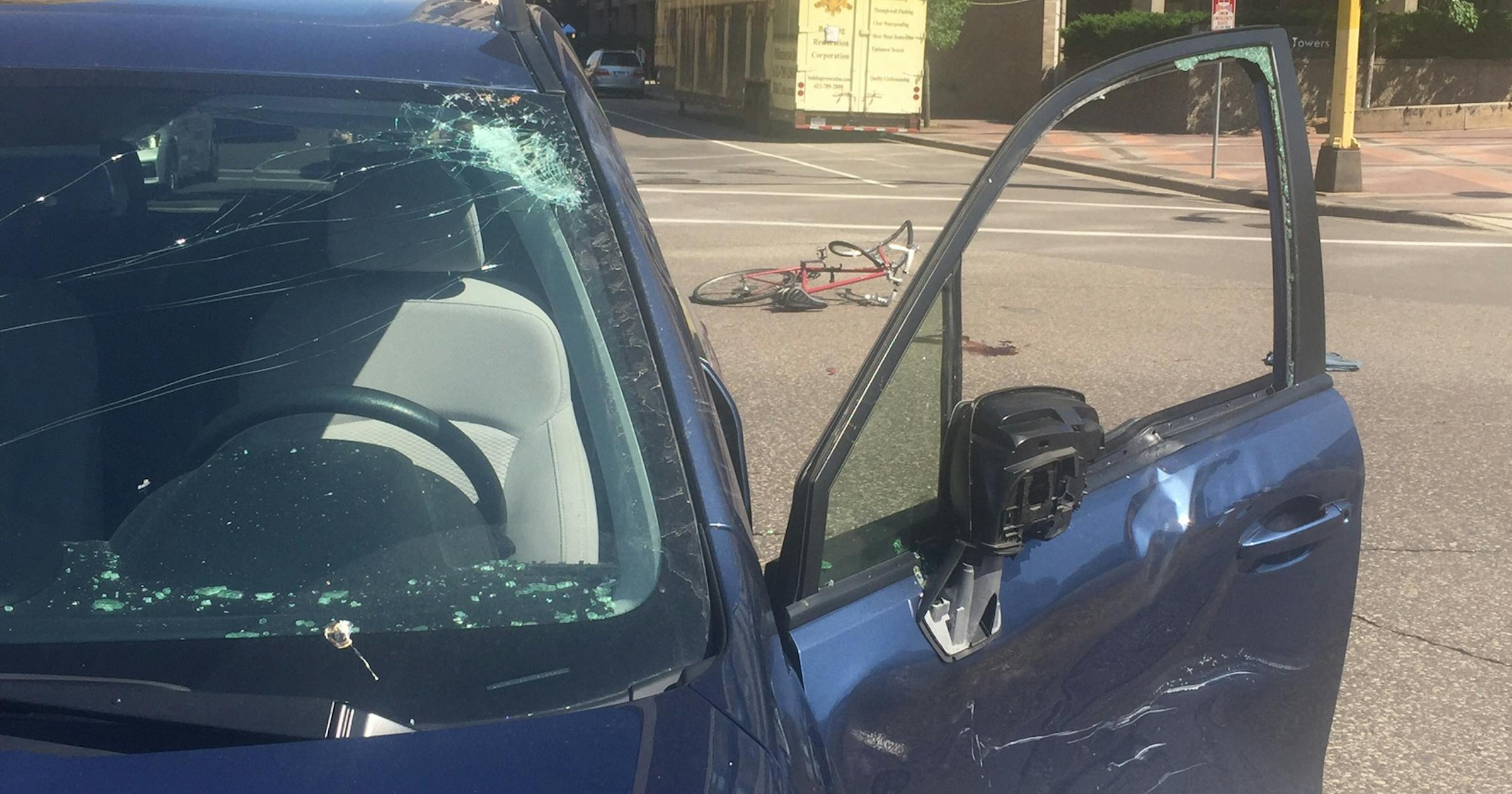 Bicyclist In Critical Condition After Running Red Light Hitting Car In
