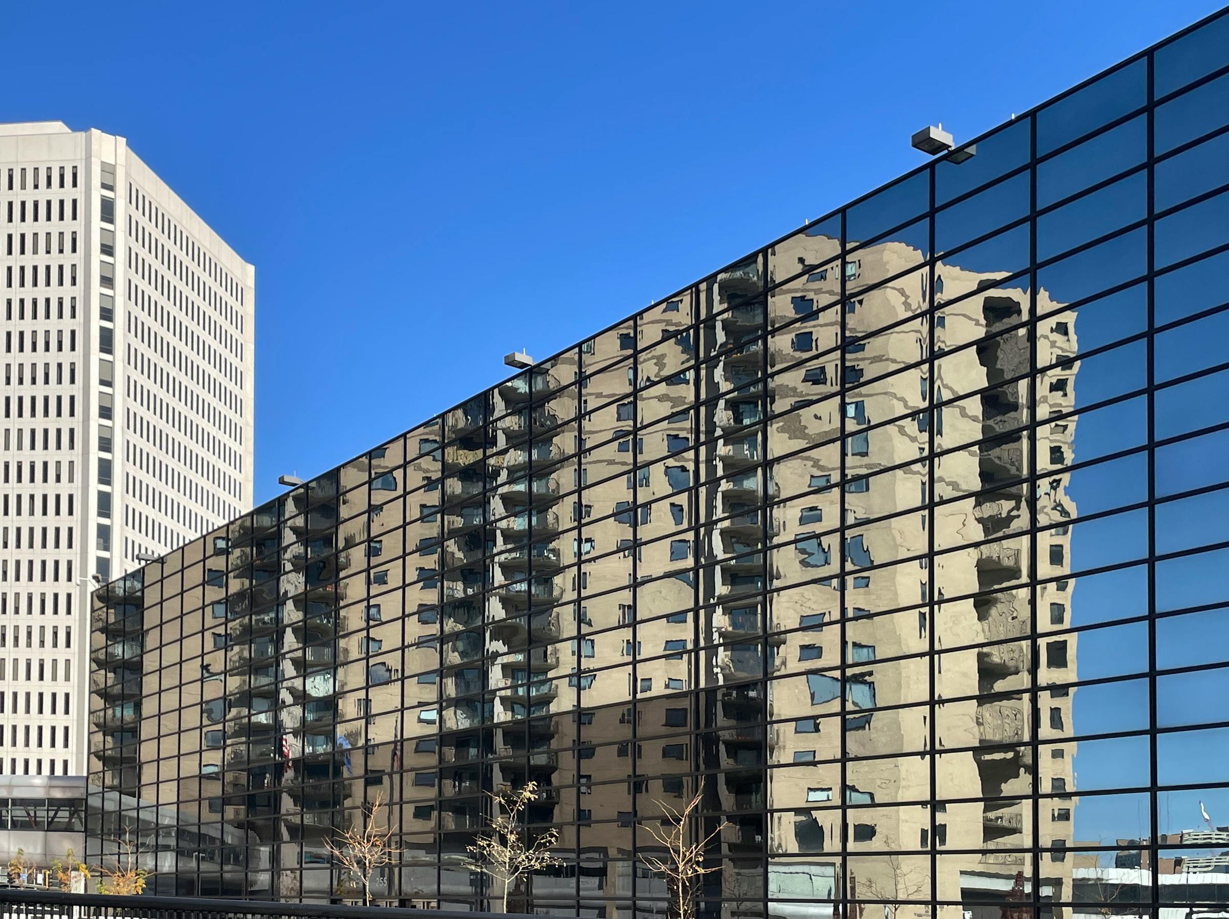Mirrored glass towers disappearing from downtown Minneapolis